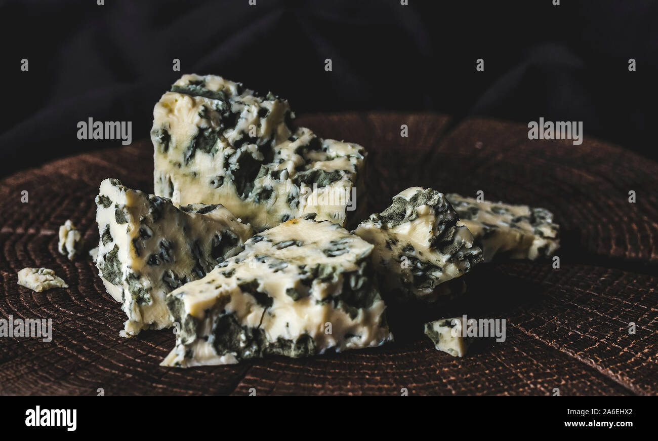 Danish blue cheese on black wooden background, with copy space Stock ...