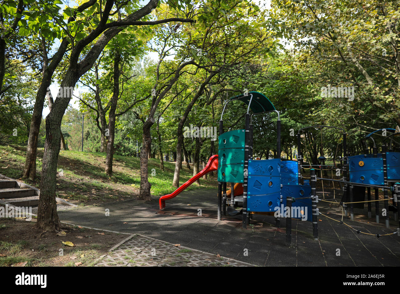 Colorful children's playground with slides, swings and other objects in ...