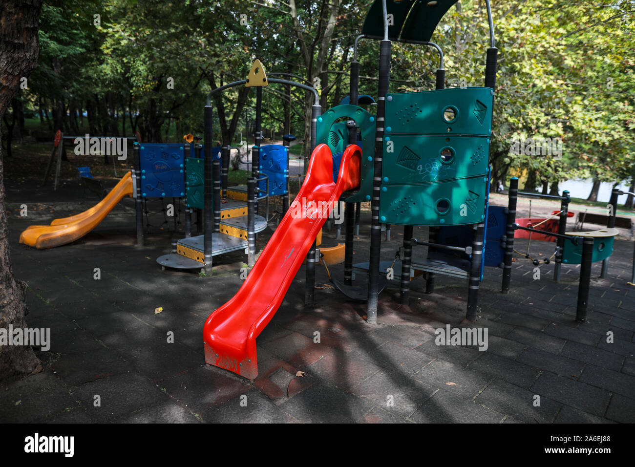 Colorful children's playground with slides, swings and other objects in ...