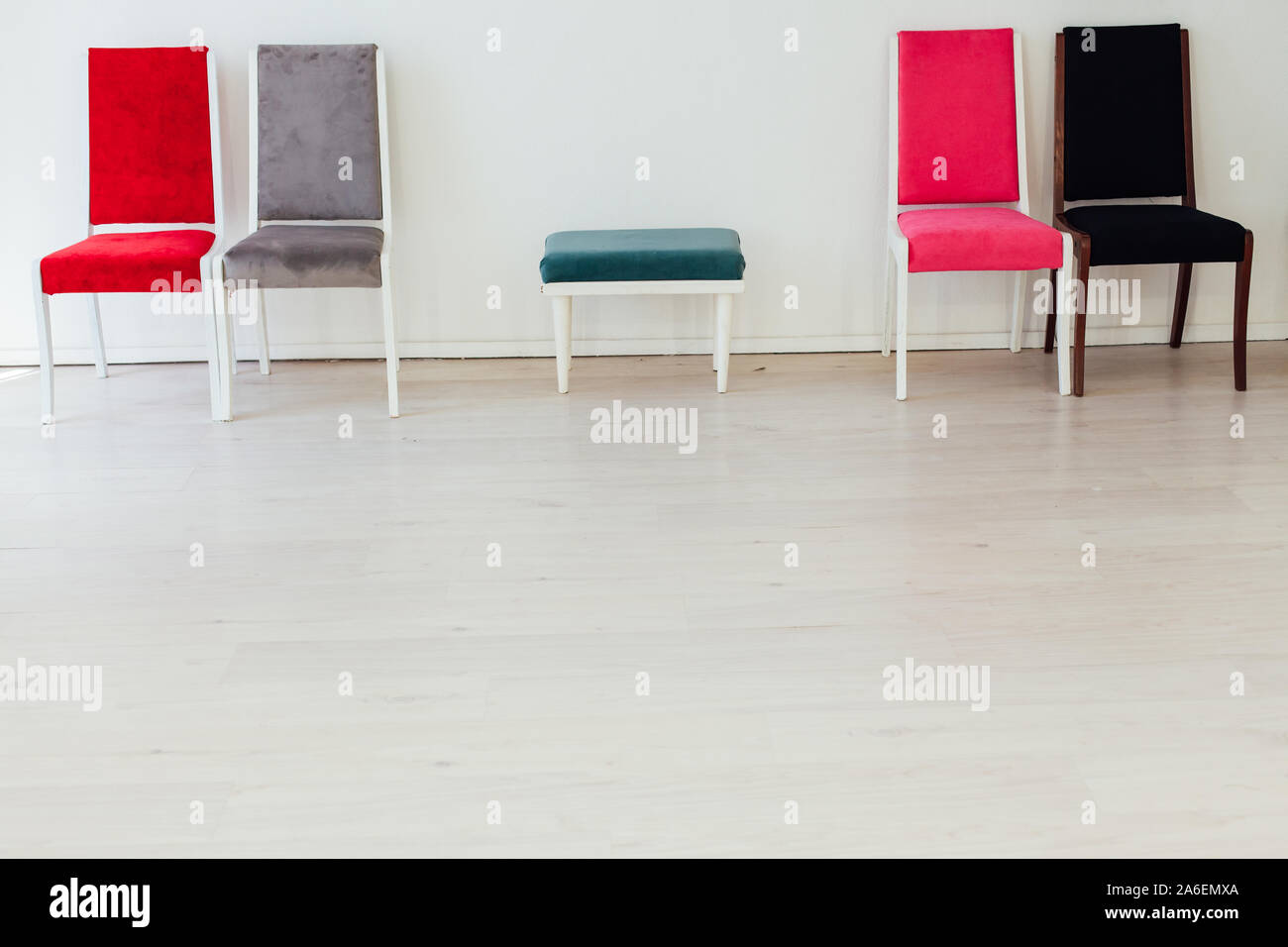 five chairs in an empty white interior room Stock Photo - Alamy