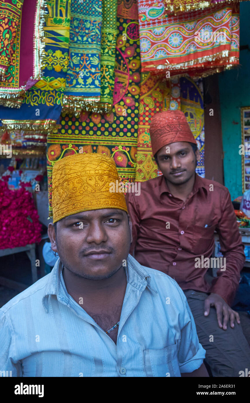 Two fez-wearing shopkeepers near Mira Datar Dargah (Muslim shrine ...