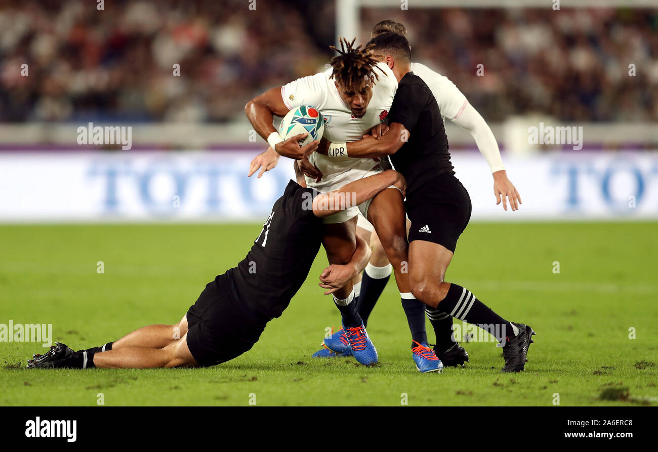England's Anthony Watson is tackled by New Zealand's George Bridge ...