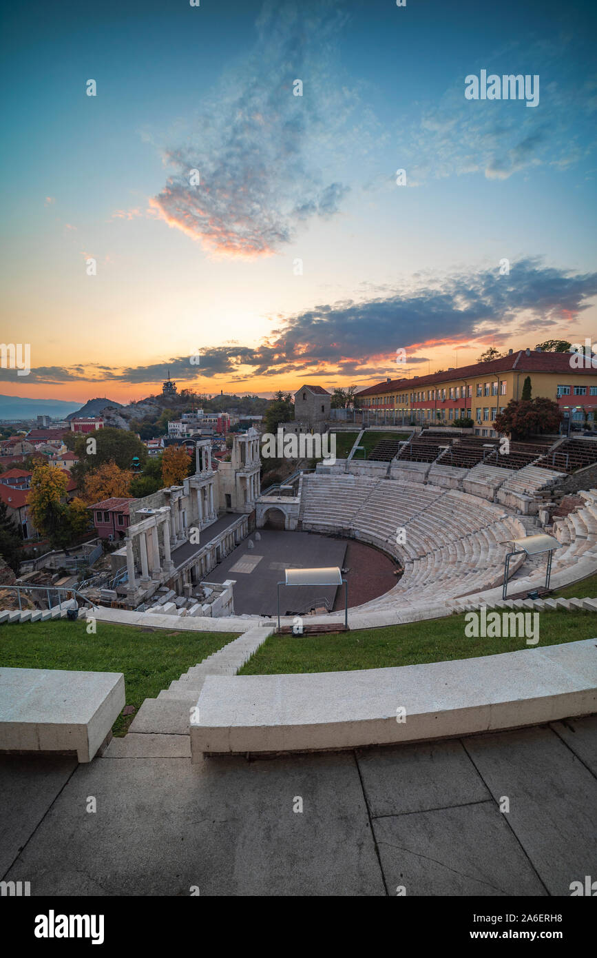 Warm autumn sunset over ancient roman amphitheatre in Plovdiv city ...