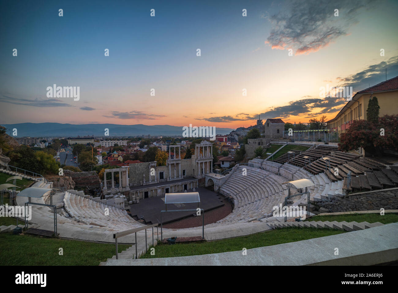 Warm autumn sunset over ancient roman amphitheatre in Plovdiv city ...