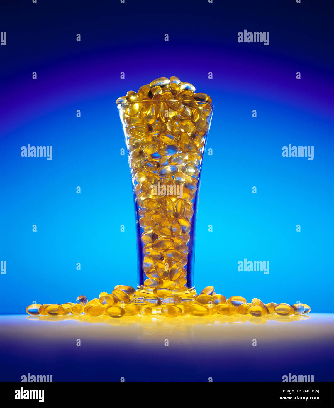 Still life. Cod Liver Oil capsules in glass Stock Photo - Alamy