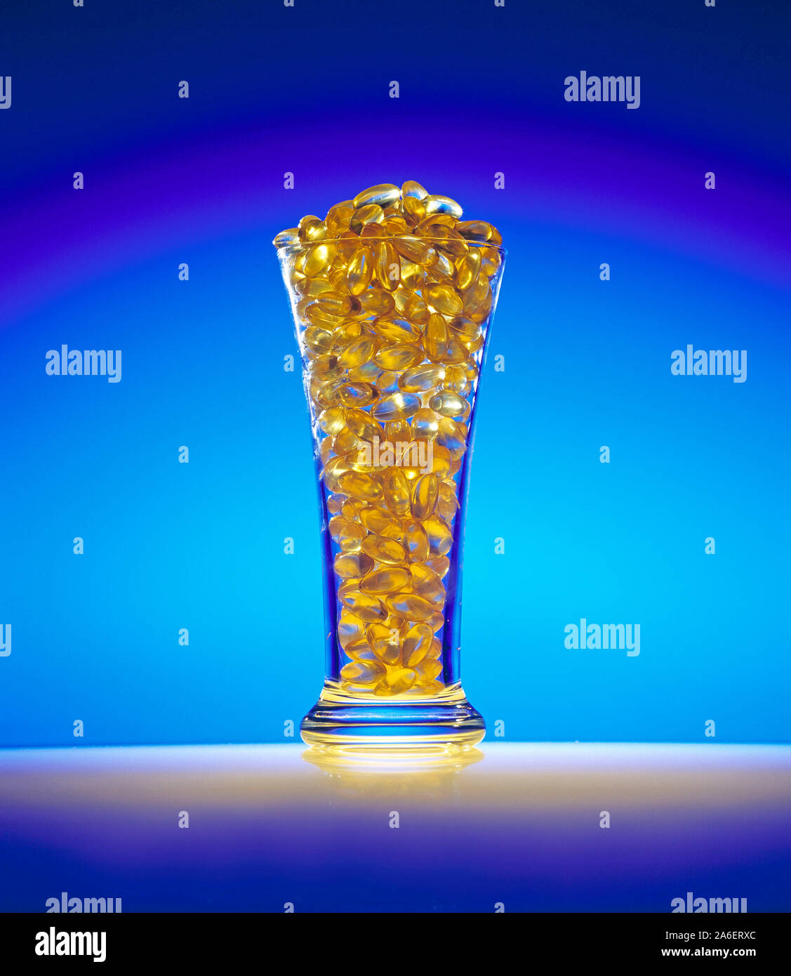 Still life. Cod Liver Oil capsules in glass Stock Photo - Alamy