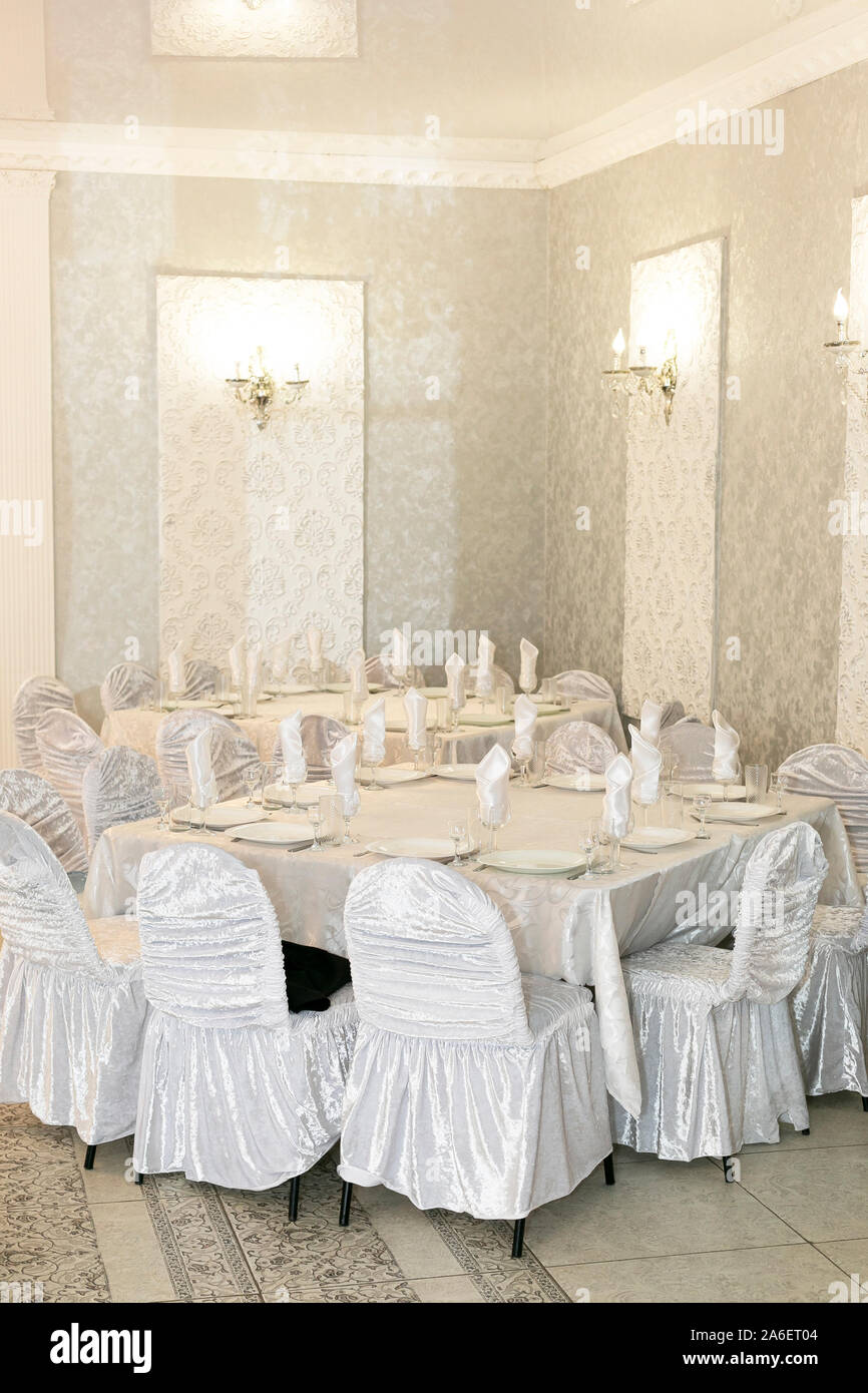 Restaurant in white design, light furniture and white tablecloths on ...