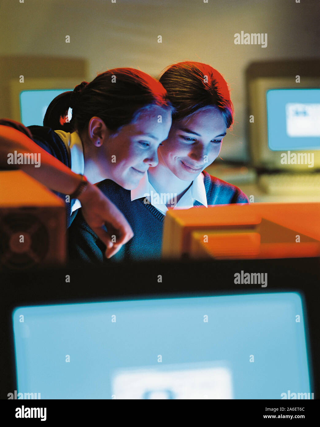 Two smiling schoolgirls in classroom hi-res stock photography and ...
