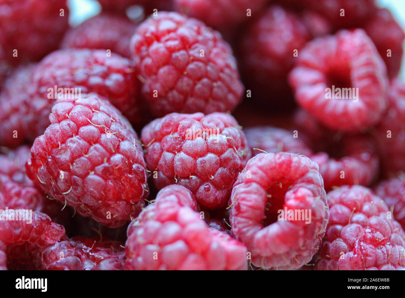 Background with fresh raspberry closeup. Raspberry macro photography ...