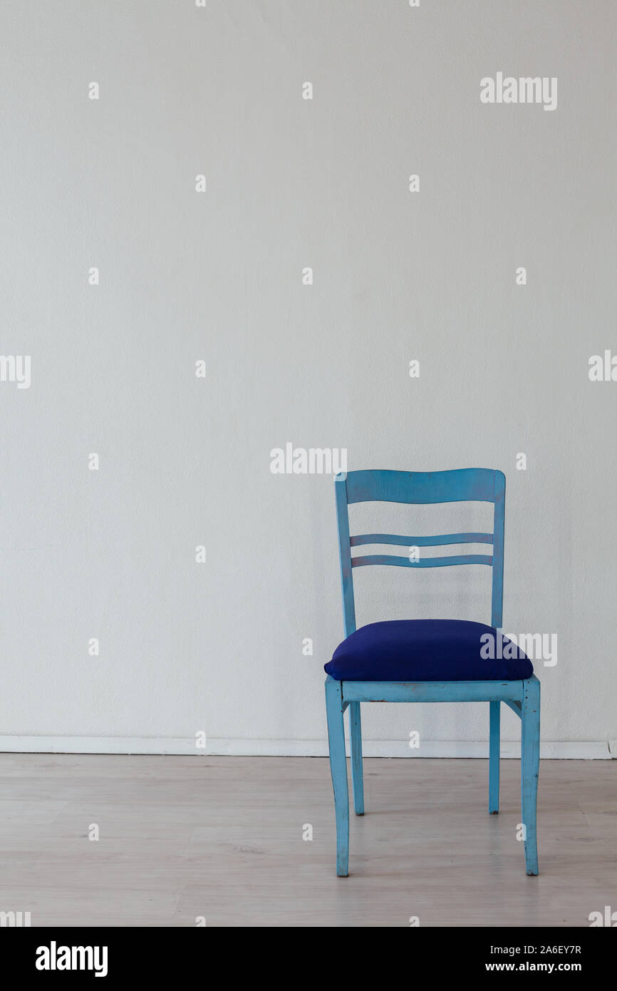 one chair in the interior of an empty white room Stock Photo - Alamy