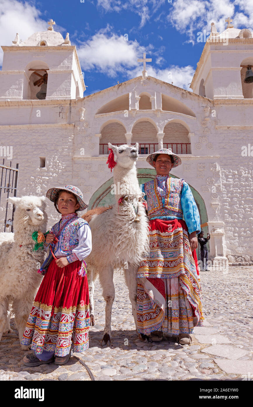 Indian woman with llama and child hi-res stock photography and images ...