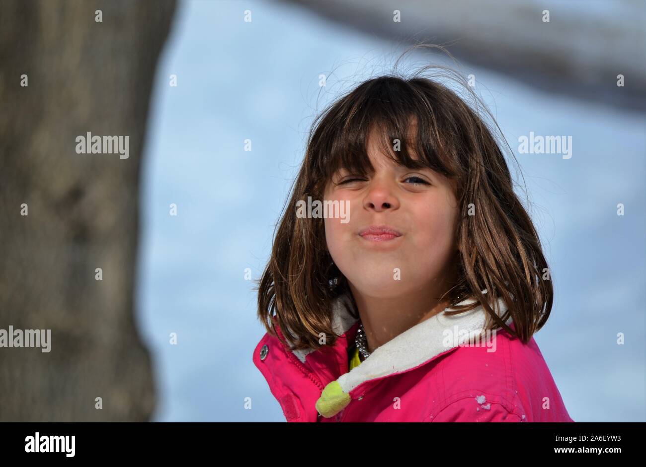Young girl with happy expressions enjoying snow in winter Stock Photo ...