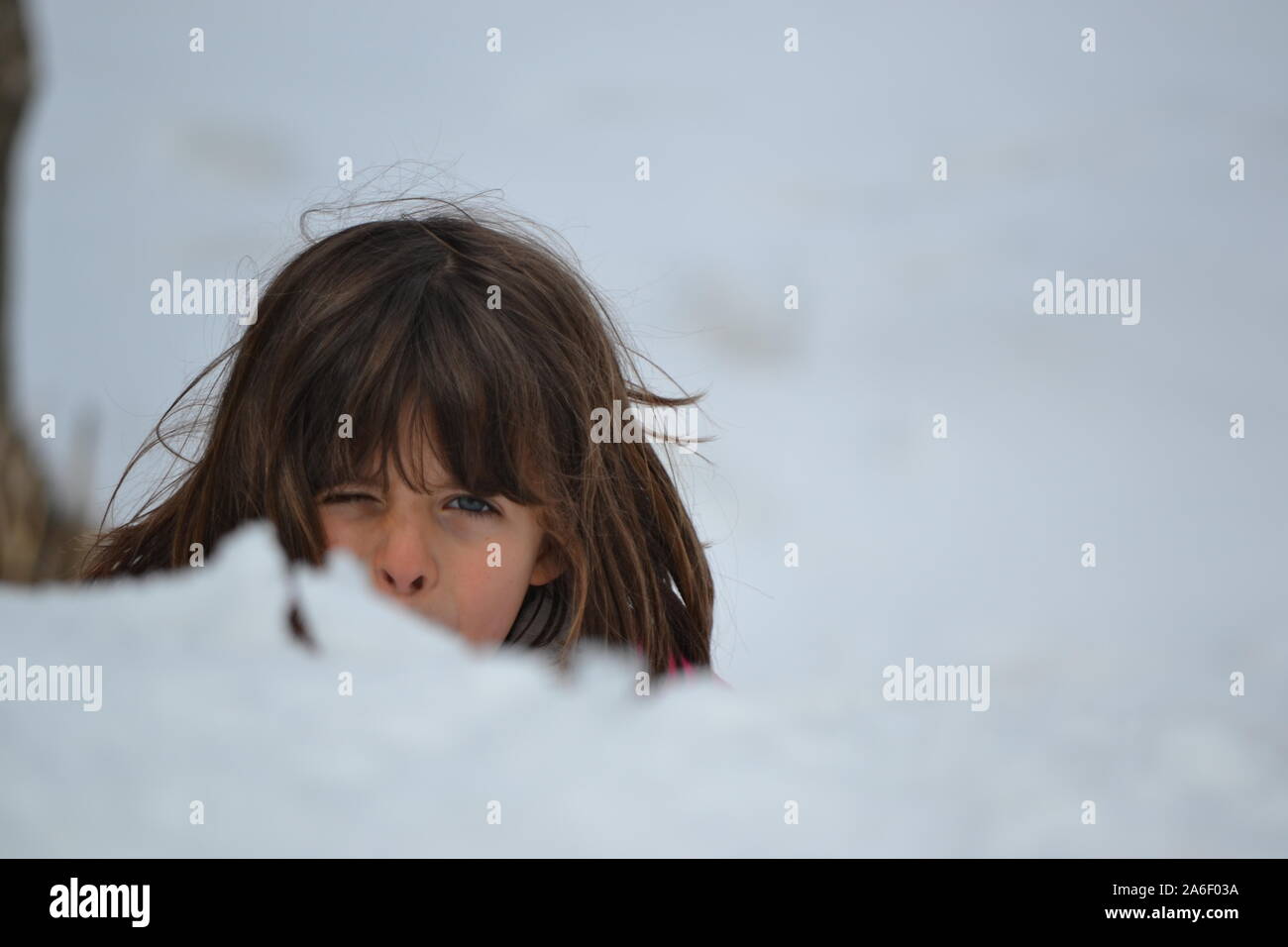Young girl with happy expressions enjoying snow in winter Stock Photo ...