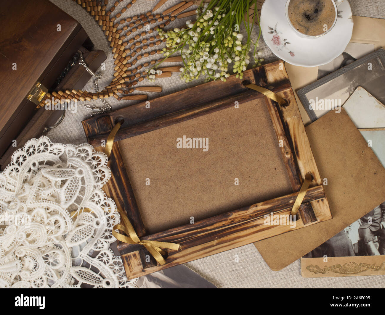 Still life with old pictures and frame for a photo Stock Photo - Alamy