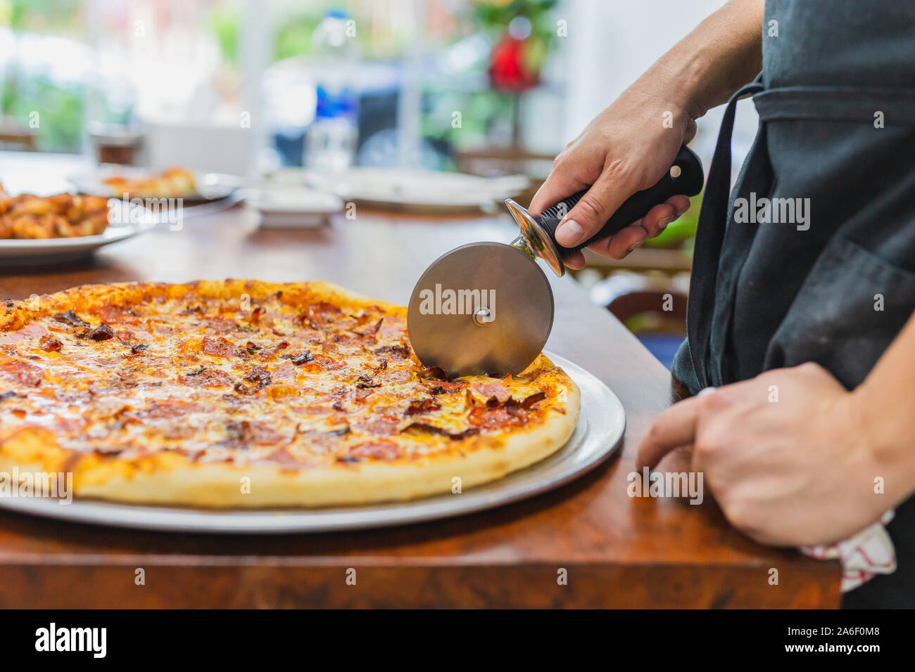 Cutting pizza slice wheel hi-res stock photography and images - Alamy