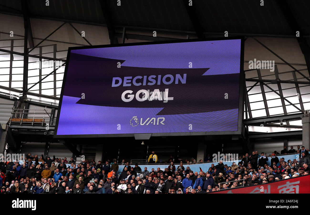 A VAR decision is displayed on the big screen as they check a goal by ...