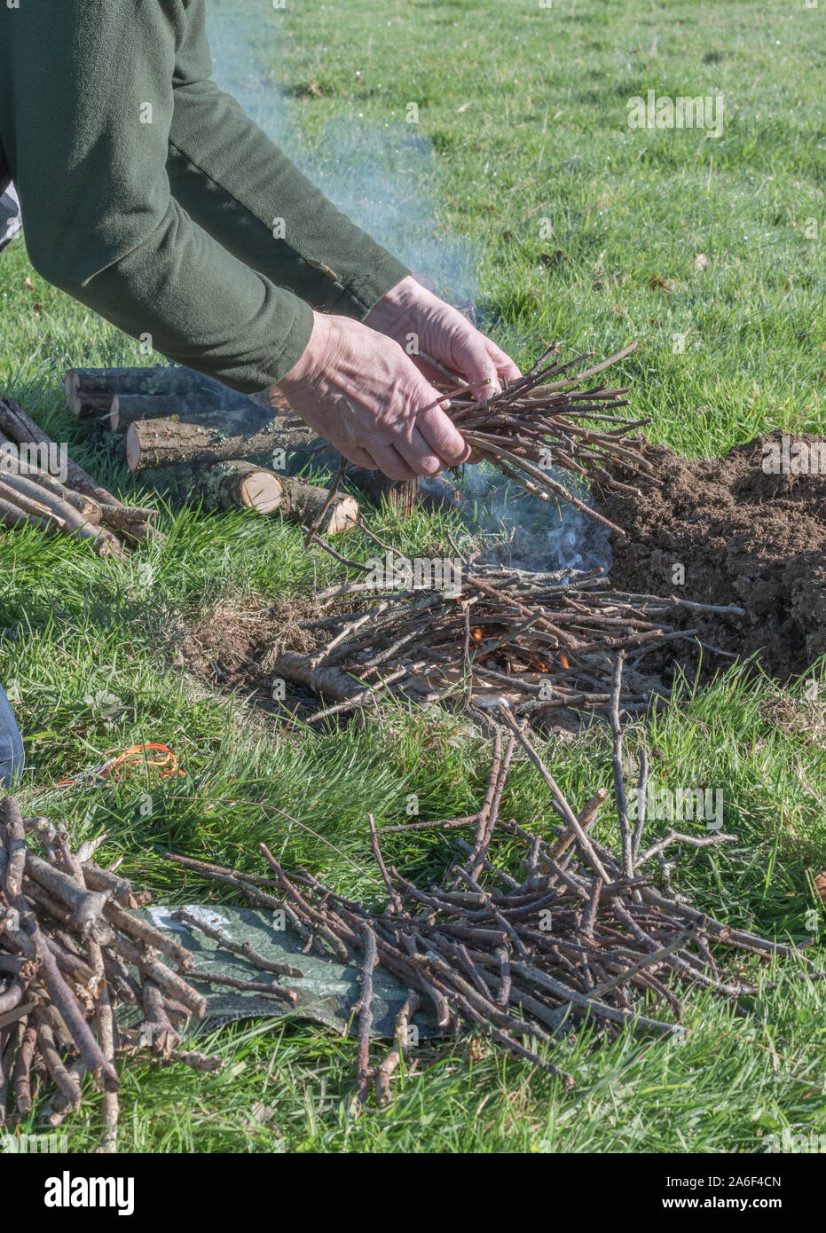 Putting A Log On The Fire Hi Res Stock Photography And Images Alamy