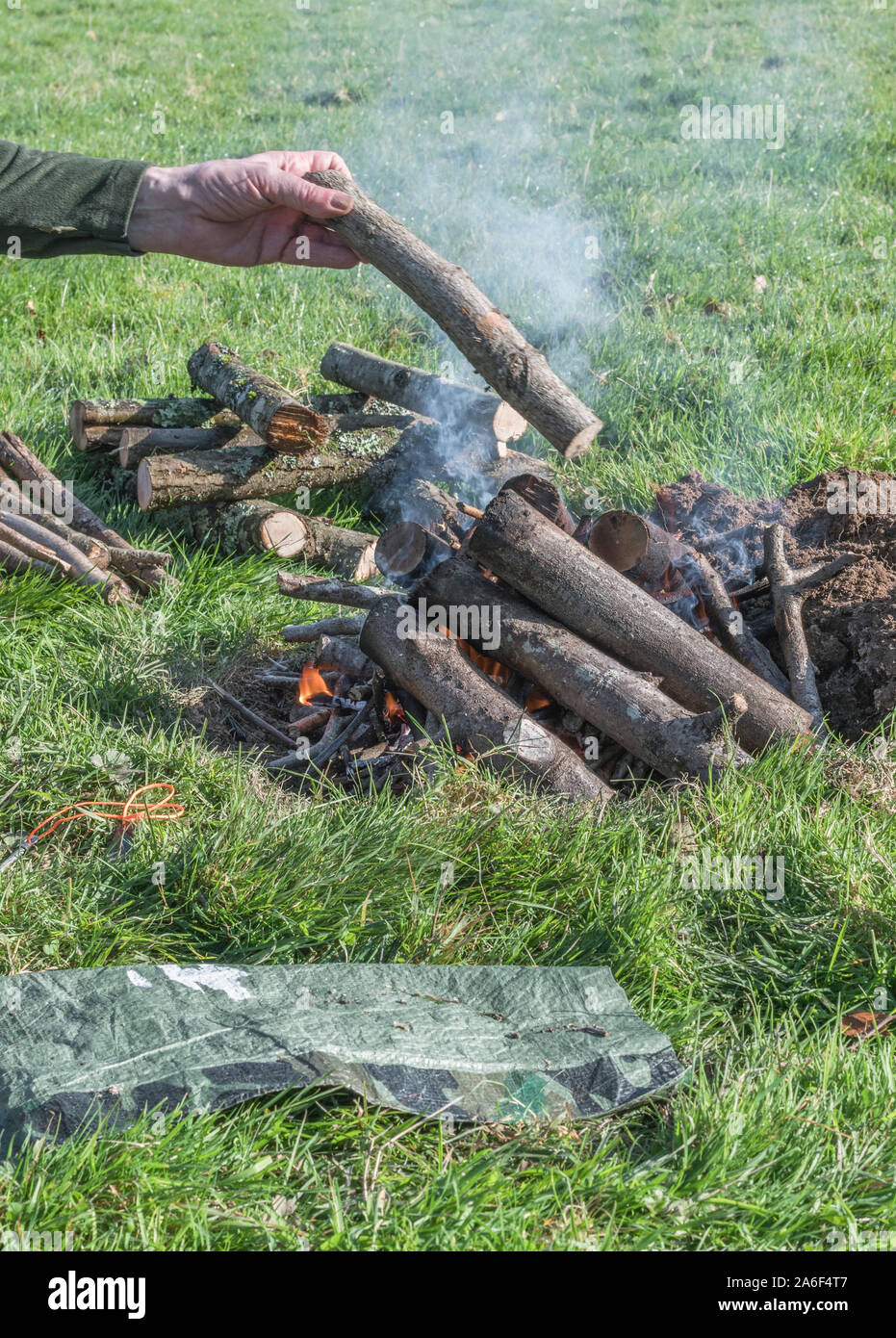 Putting A Log On The Fire Hi Res Stock Photography And Images Alamy