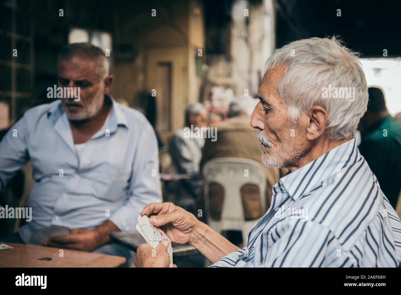 Group of old men playing cards hi-res stock photography and images - Alamy