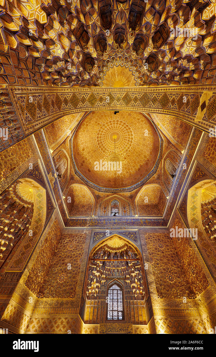 interior shot of magnificently golden decorated Amir-Timur-Mausoleum or ...