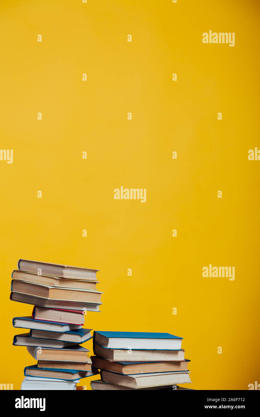 library of many different educational books on a yellow background ...