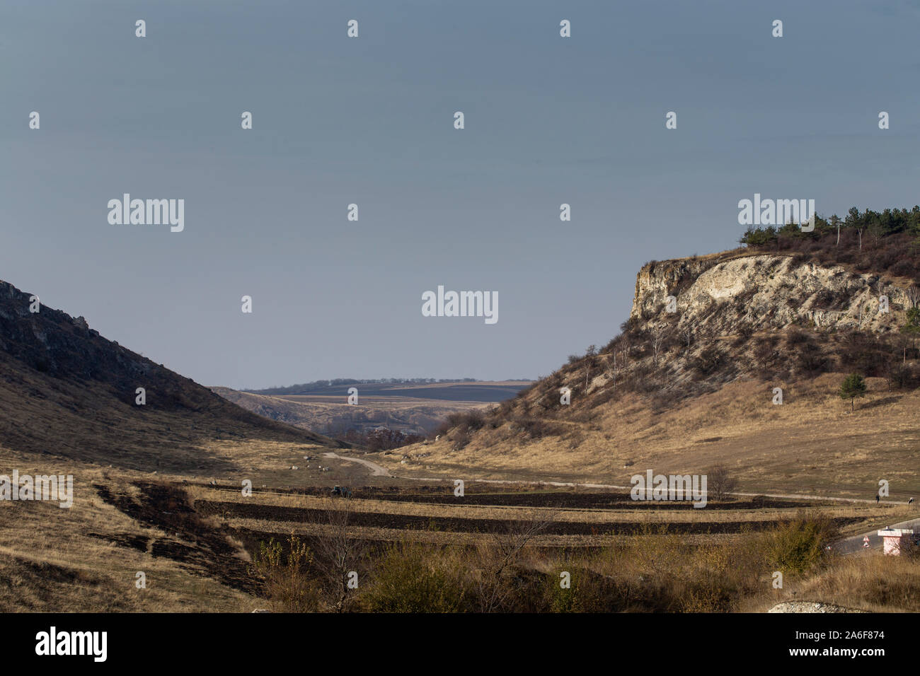 View of a village in the valley. That village located between two hills ...