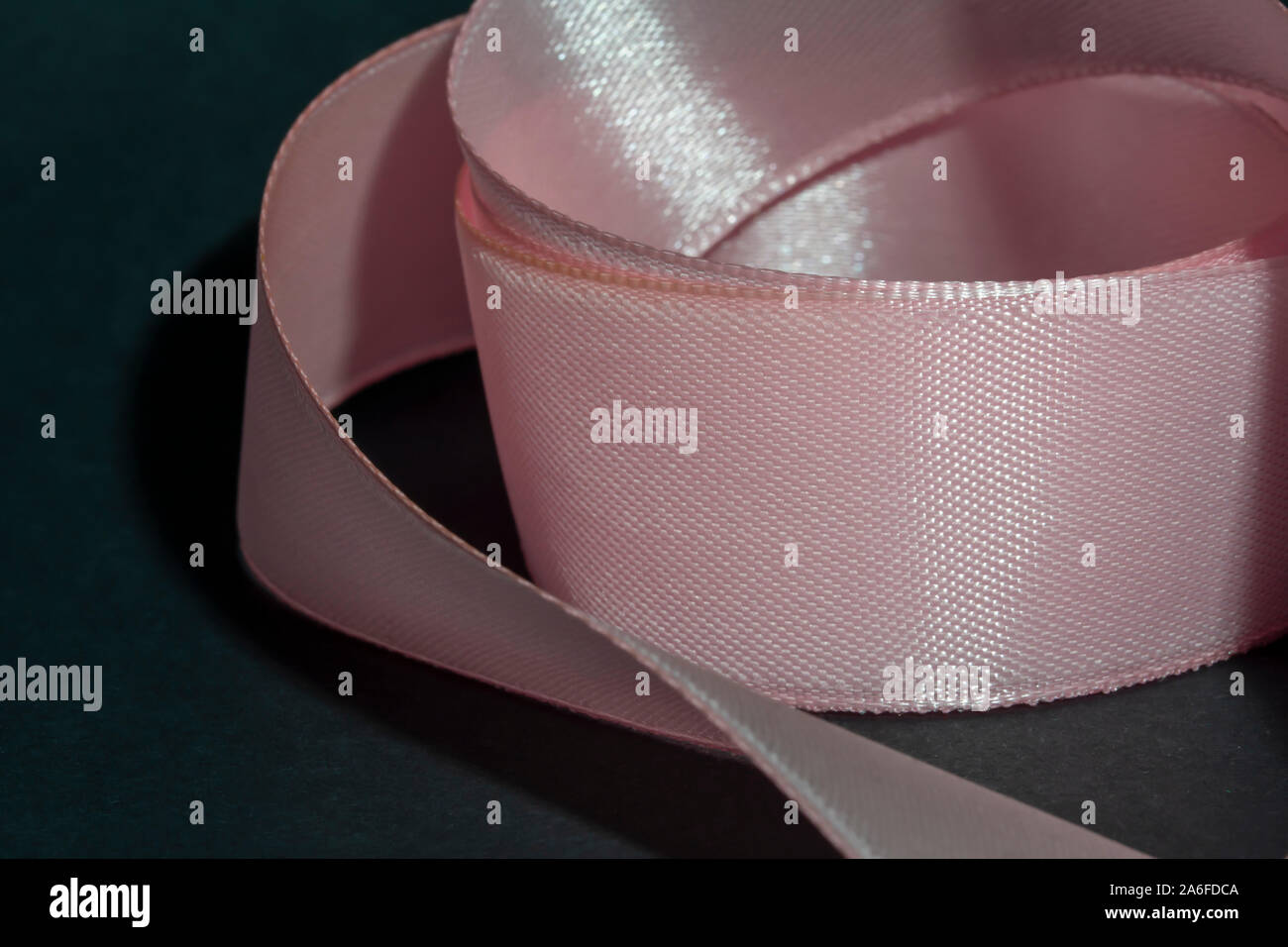 pink ribbon on black background Stock Photo - Alamy