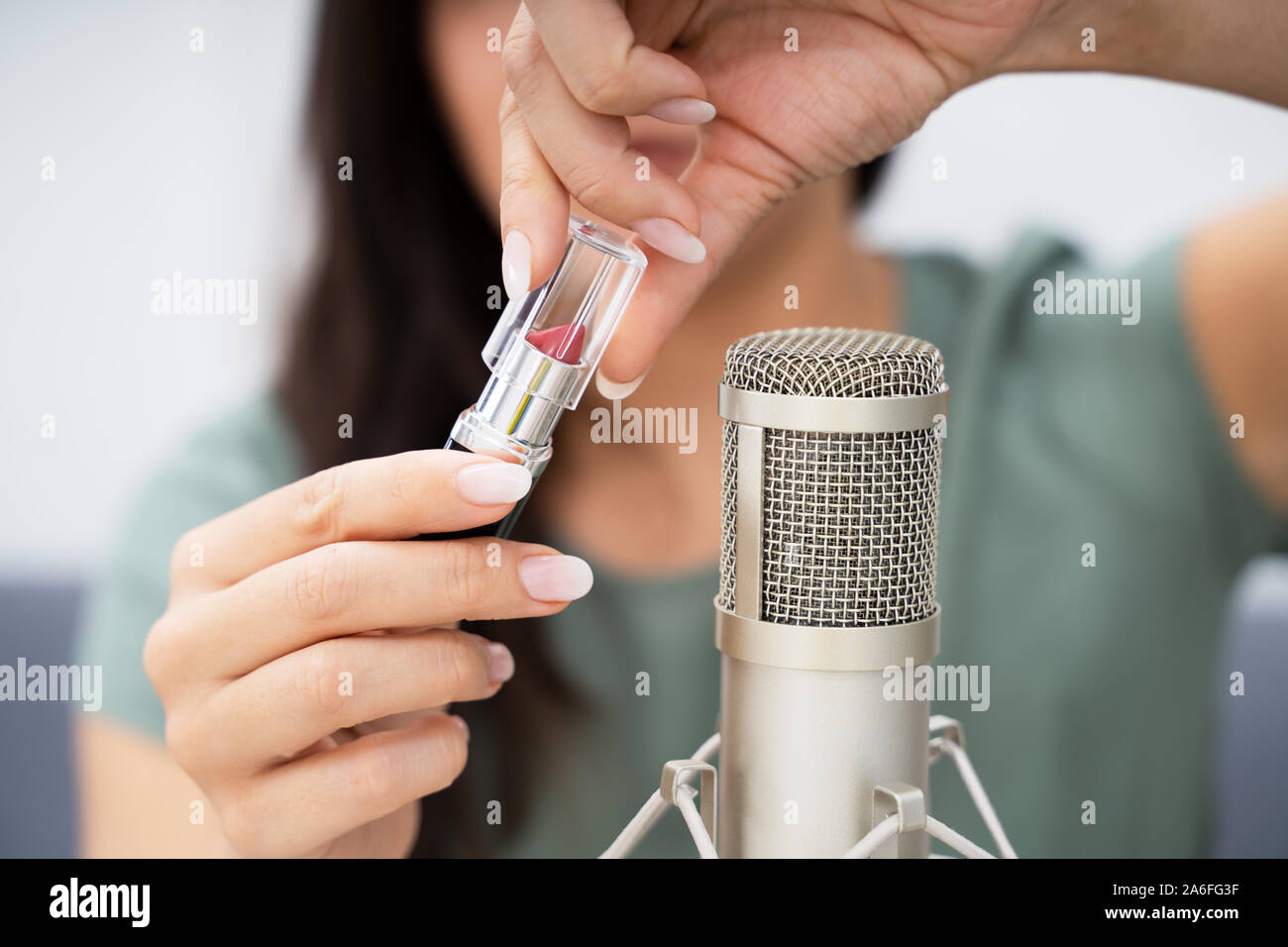 Woman Opening Lipstick On Microphone To Make ASMR Sounds Stock Photo ...