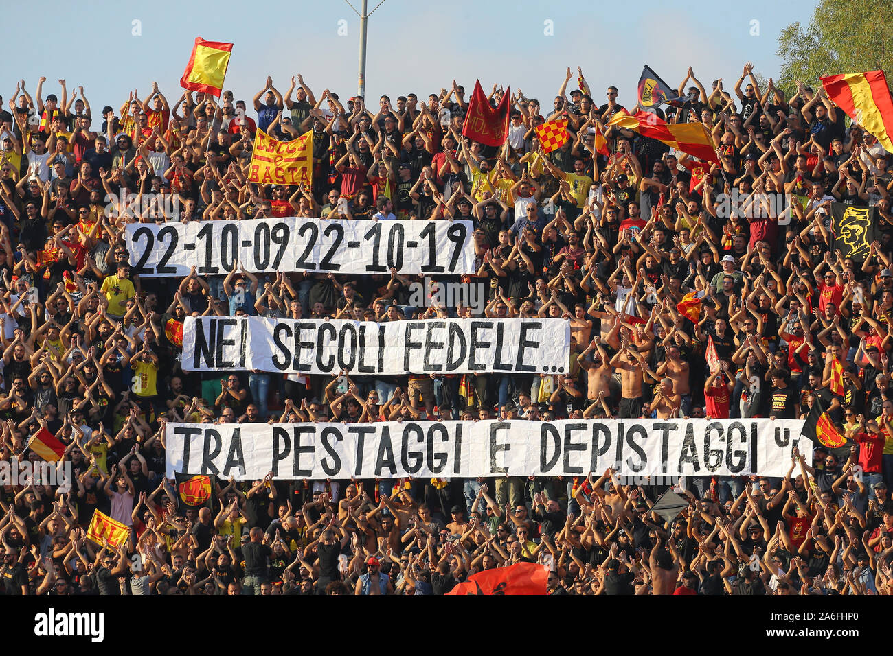 Lecce, Italy. 26th October 2019. Lecce fans hold a banner in tribute of ...