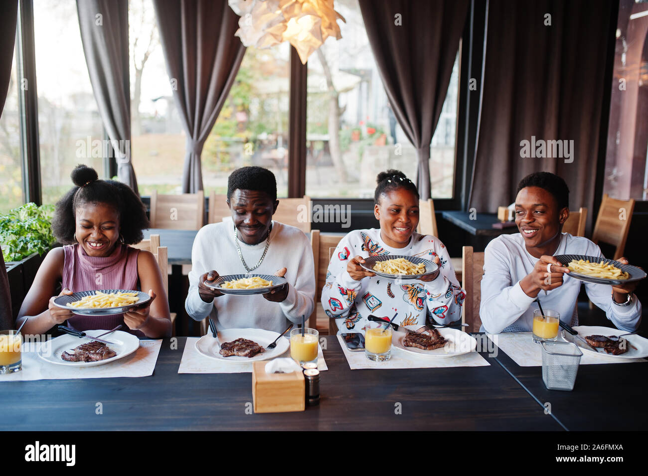 Black People Eating At Restaurant