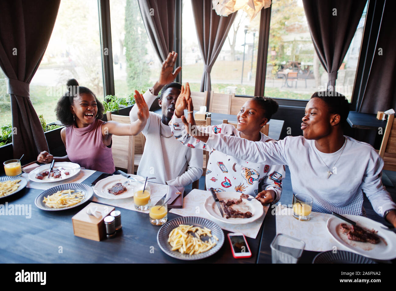 Black People Eating At Restaurant