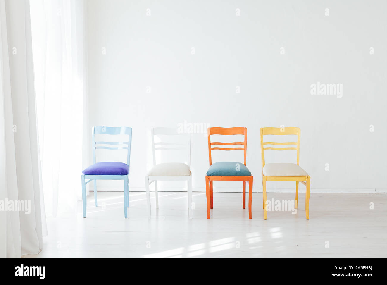 four chairs in the interior of an empty white room Stock Photo - Alamy