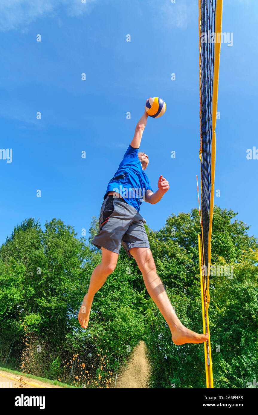 Intensive game on beachvolleyball court, fighting spirit to save the ...