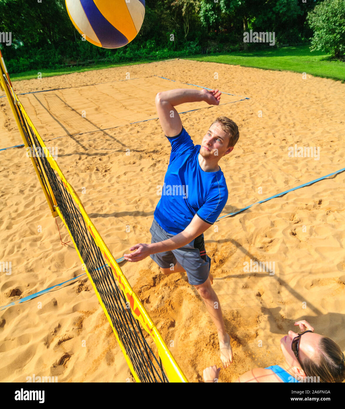 Intensive game on beachvolleyball court, fighting spirit to save the ...