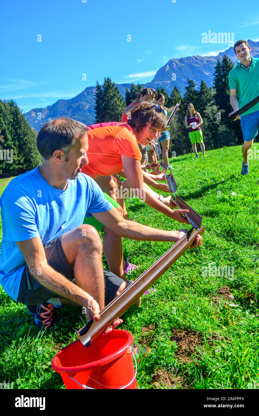 Teambuilding exercises in autumnal nature Stock Photo - Alamy