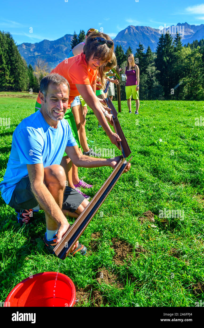 Teambuilding exercises in autumnal nature Stock Photo - Alamy