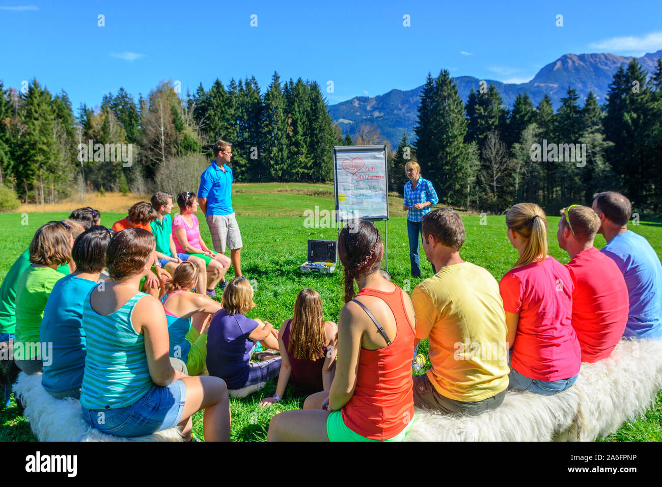A group at a teambuilding training course Stock Photo - Alamy