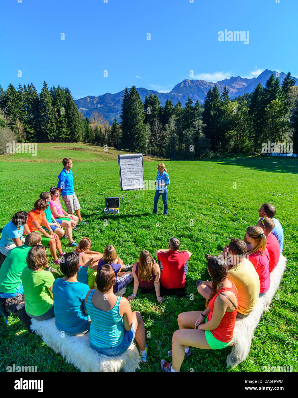 A group at a teambuilding training course Stock Photo - Alamy
