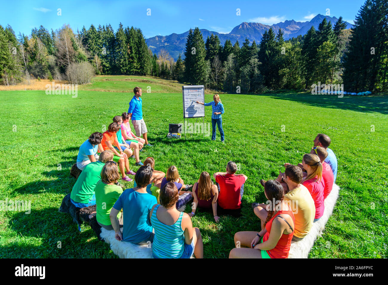 A group at a teambuilding training course Stock Photo - Alamy