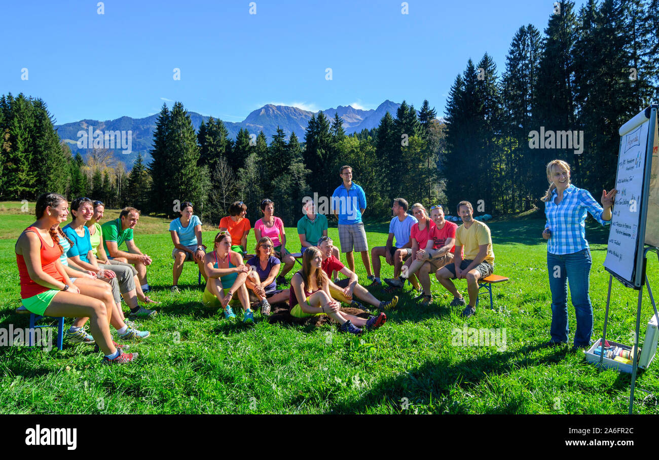 A group at a teambuilding training course Stock Photo - Alamy