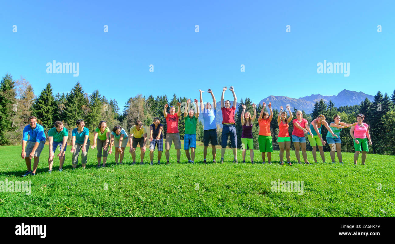 A large group of people celebrating their successful team training ...