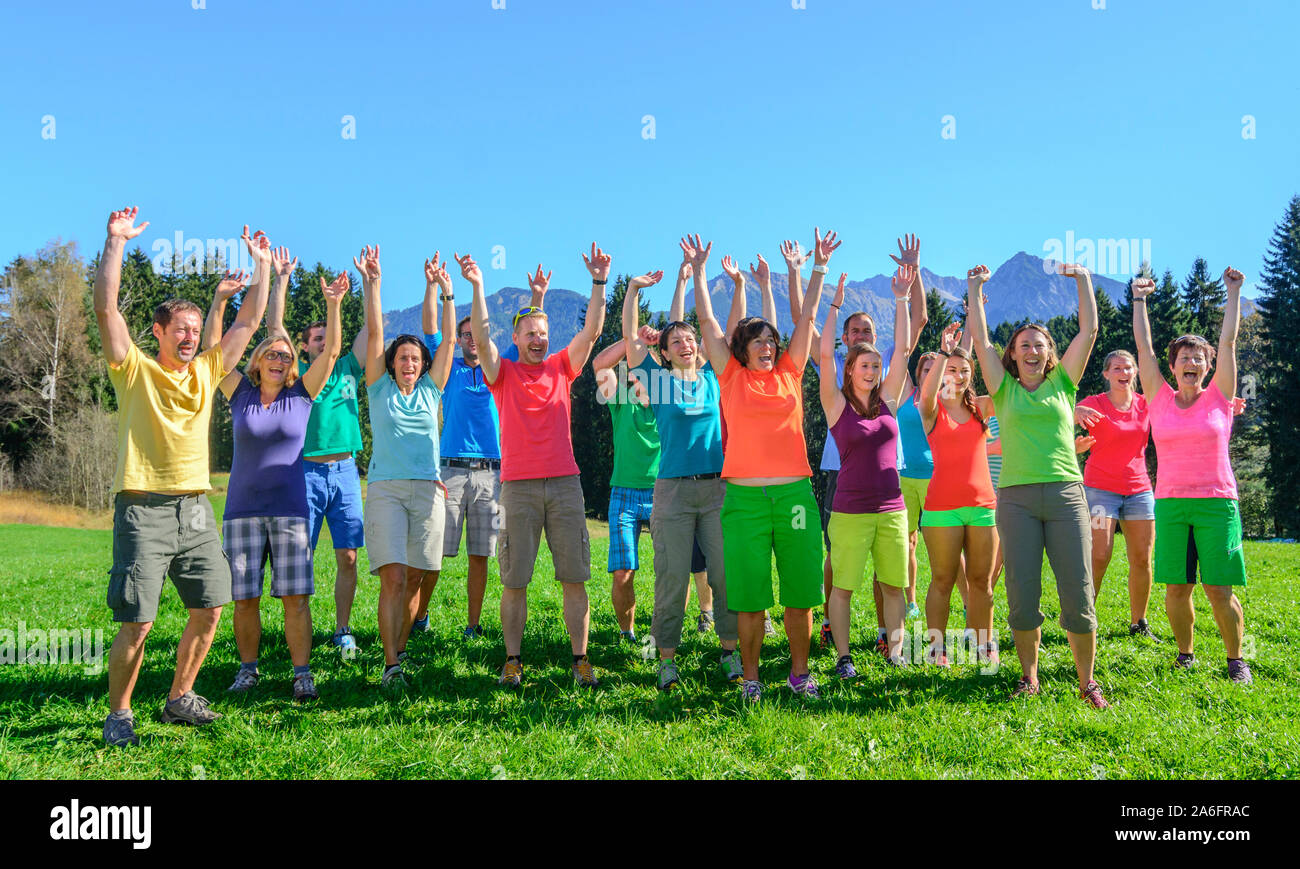 A large group of people celebrating their successful team training ...