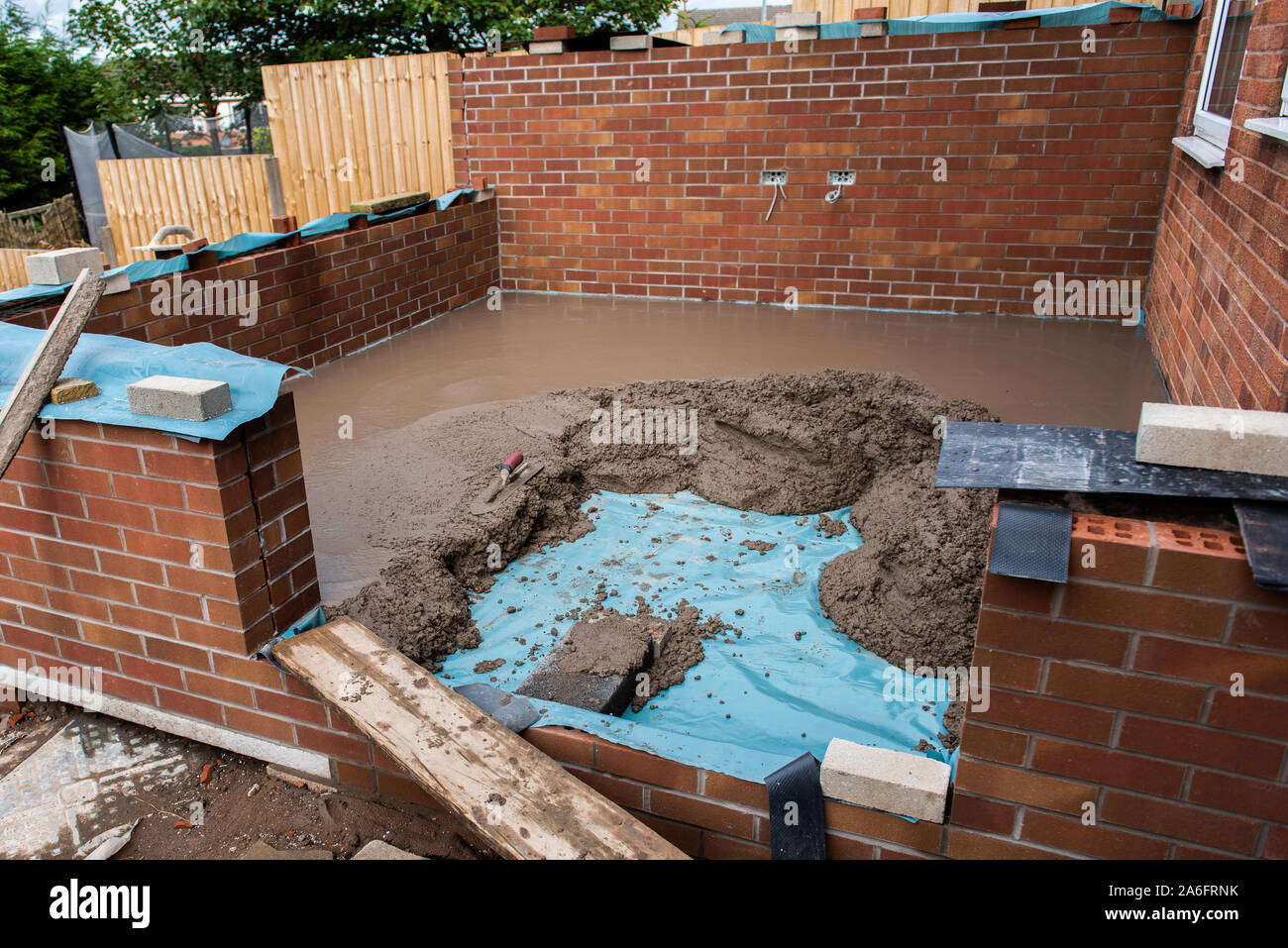 Work commences on the foundations of a conservatory base, laying ...