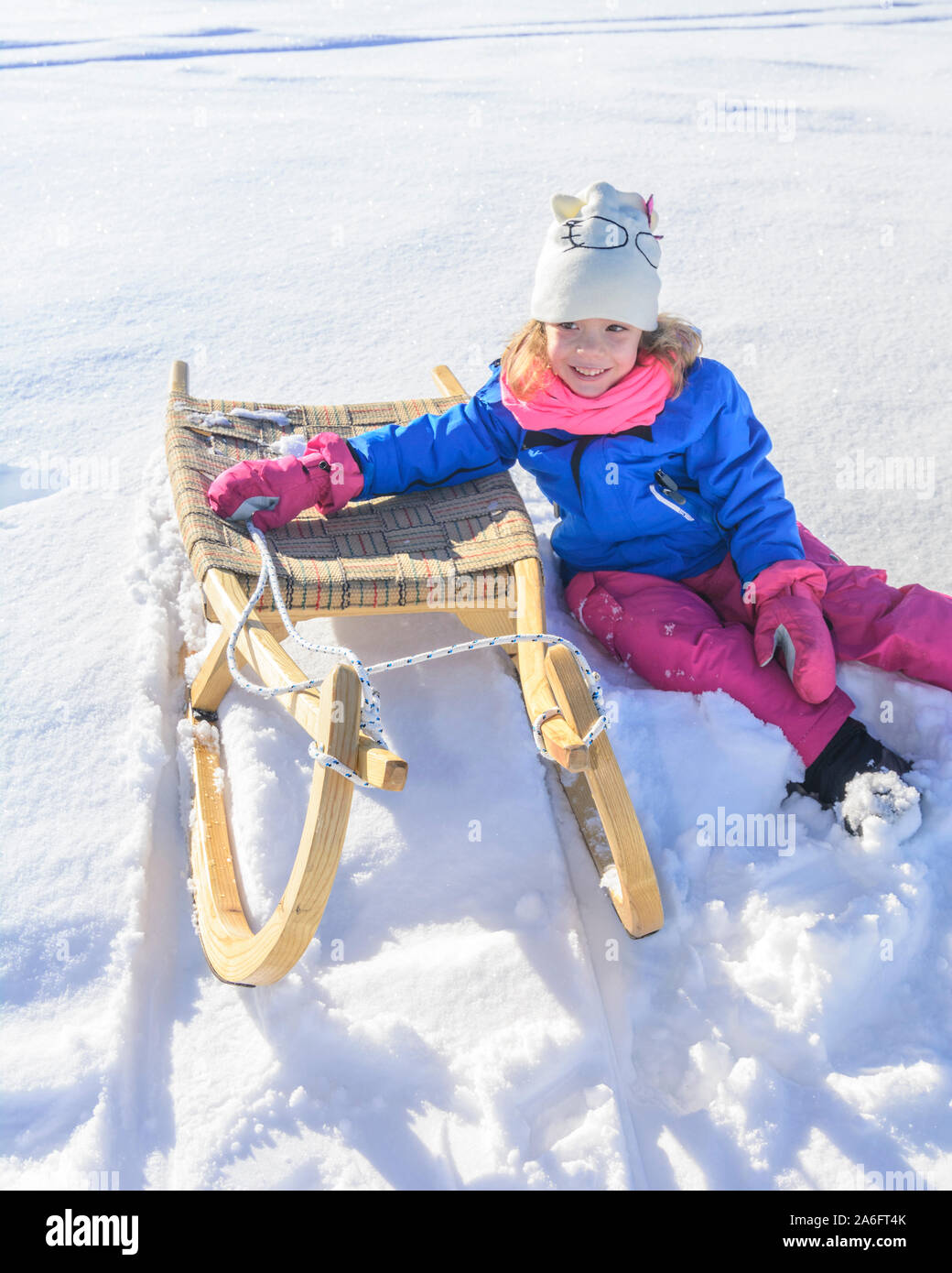 Funny afternoon in wintertime on sleigh slope Stock Photo - Alamy