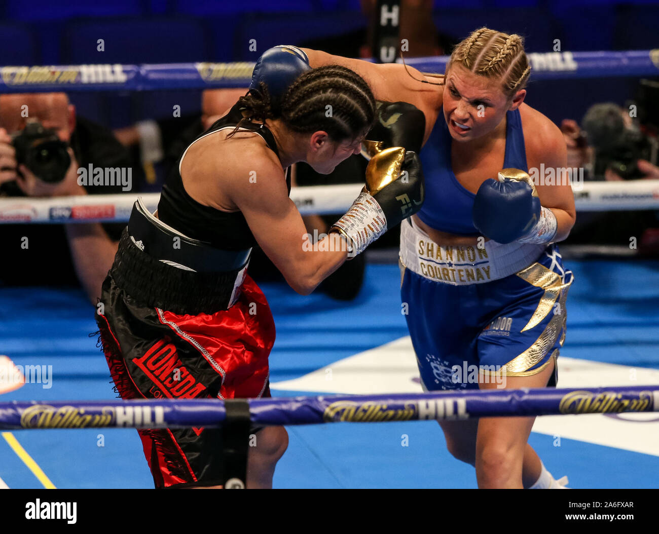 Shannon Courtenay (right) during the bantamweight contest with Jasmina ...