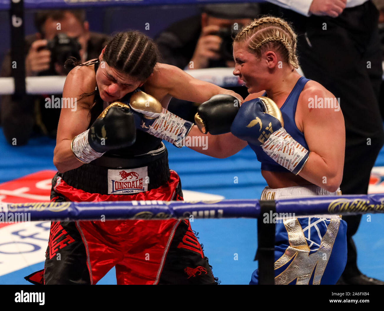 Shannon Courtenay (right) during the bantamweight contest with Jasmina ...