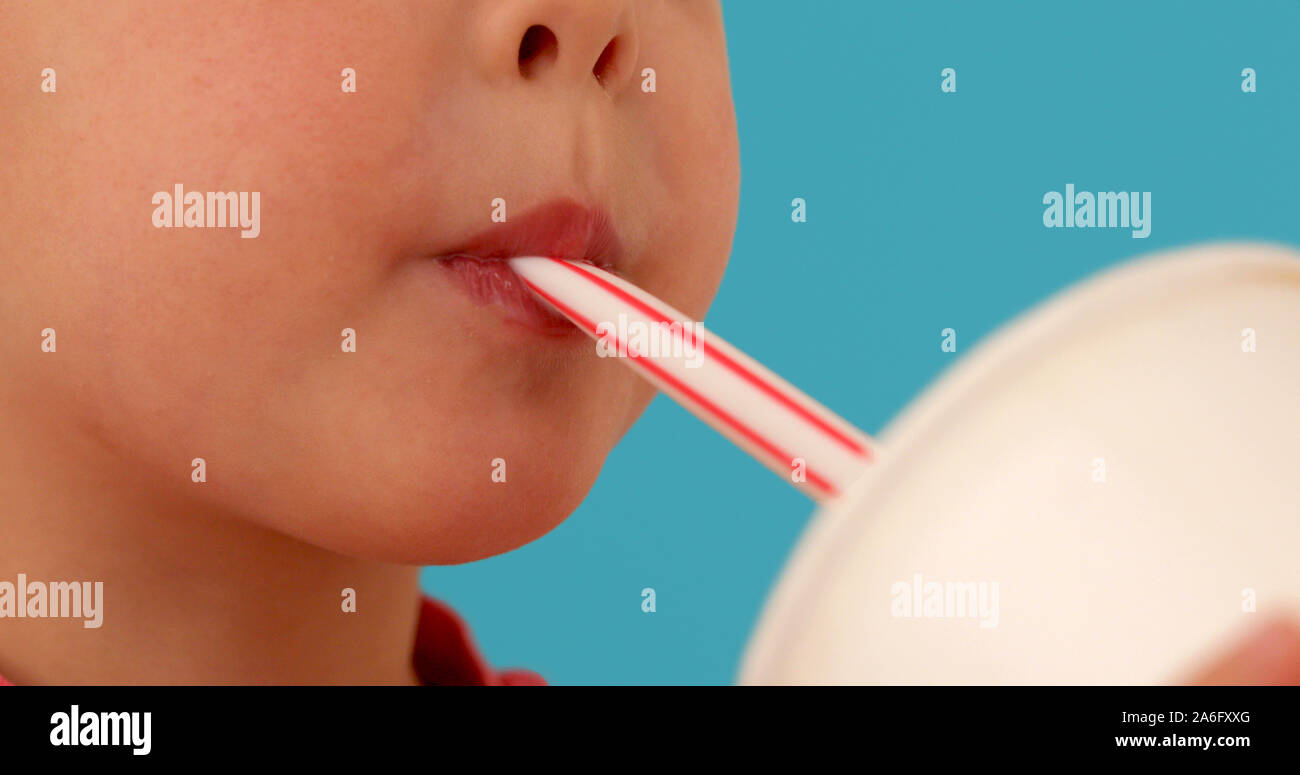 Baby drinking milkshake Stock Photo - Alamy