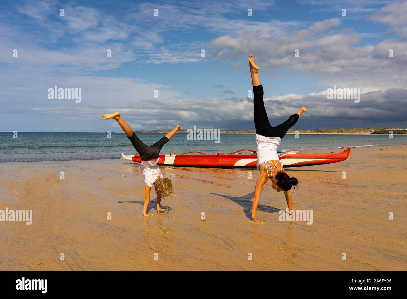 Two People Doing A Cartwheel