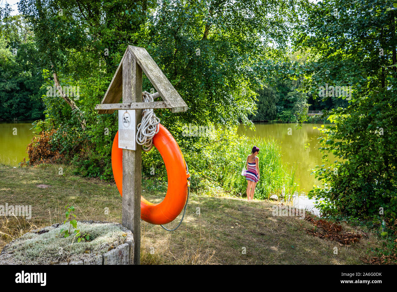 Caution deep water sign, by the side of a large lake, river, hazard ...