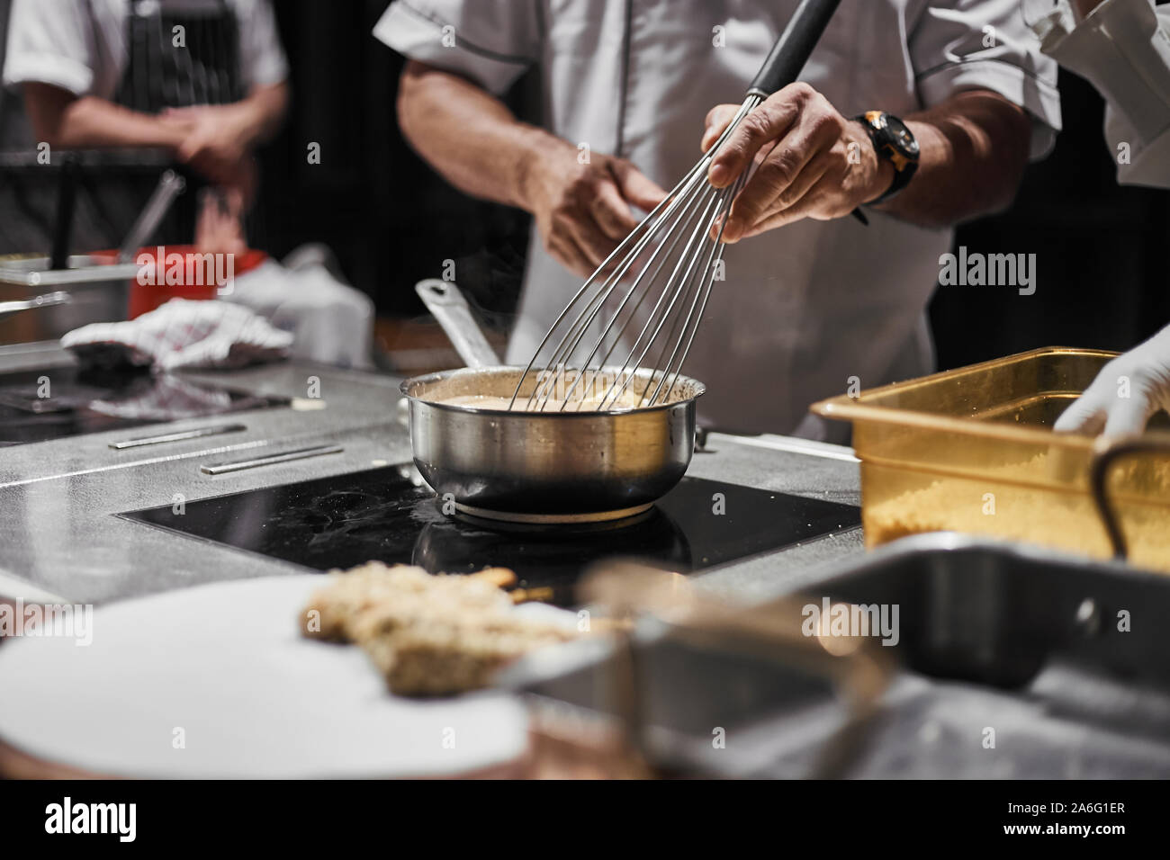 Chef cooking in a kitchen Stock Photo - Alamy